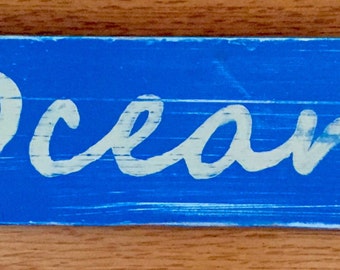 Pretty blue wooden Ocean sign.