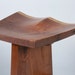 Walnut stools made in natural edge wide plank walnut.