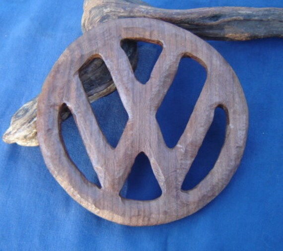 Carved wood Volkswagon emblem. Walnut wood VW bus wall