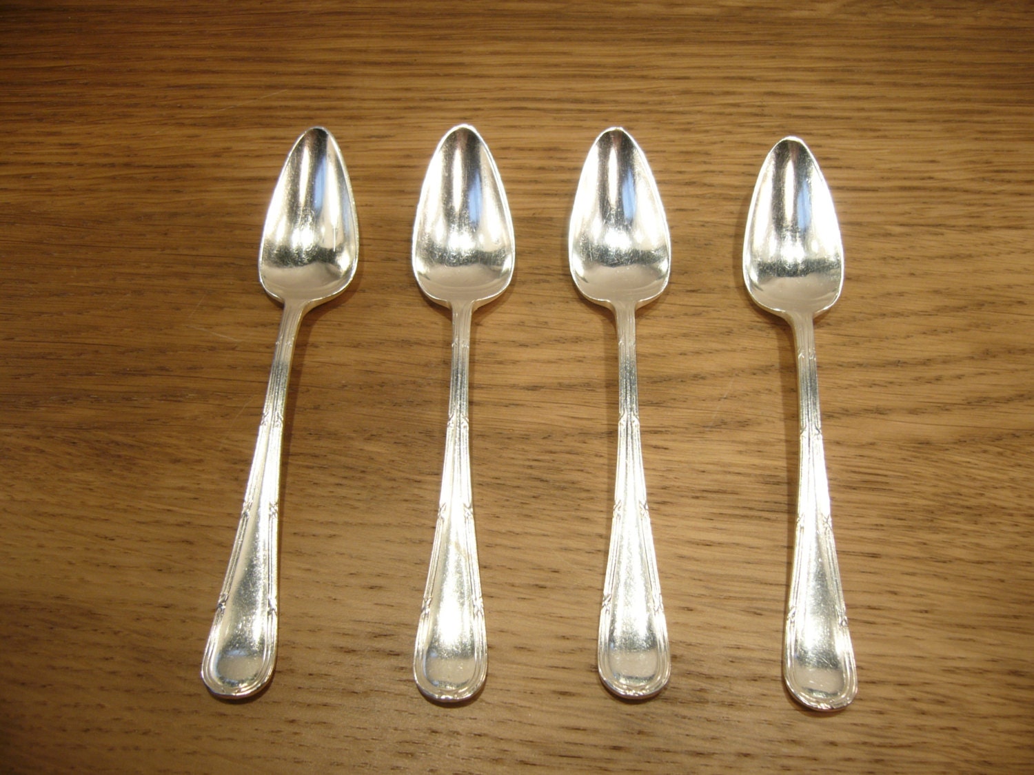 Vintage mid century four A1 silver plated grapefruit spoons, in oval ...