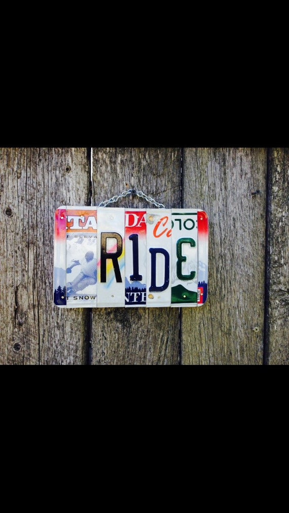 License plate art. Skier. Ride. License plate. Sign. Cabin.