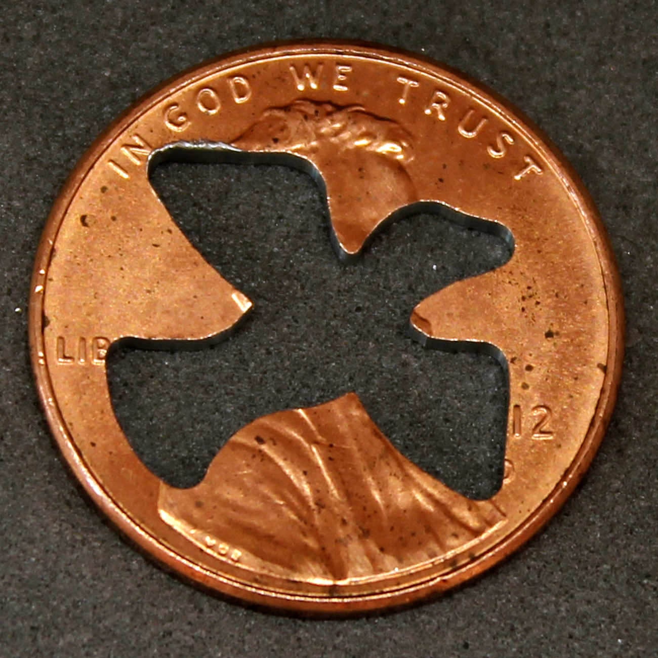 Lucky penny with dove cut out