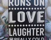 Items similar to This home runs on sign, Love and laughter sign, really ...