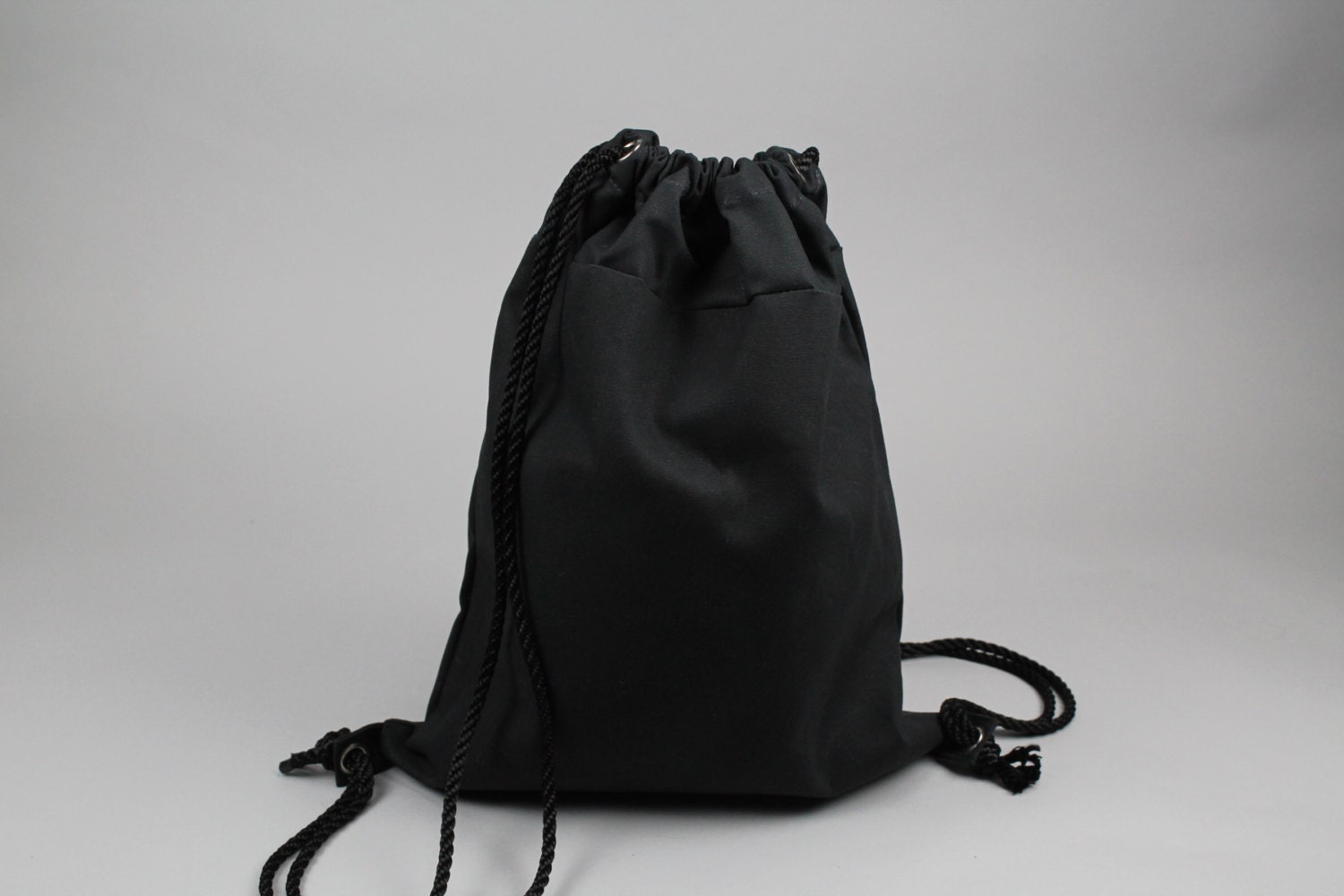 The Daniel Drawstring Backpack // Black Waxed Canvas