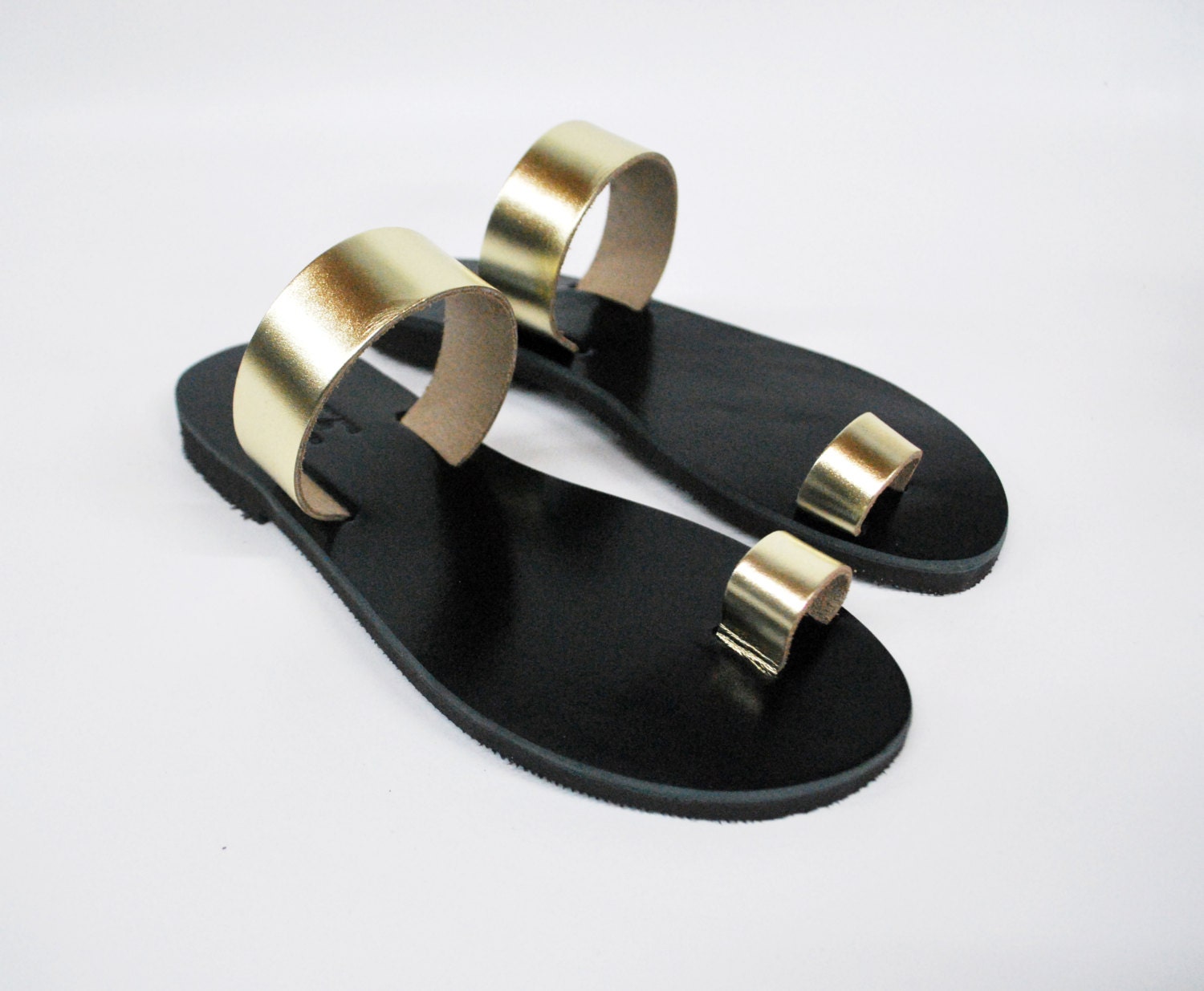 Gold metallic womens sandals with black leather sole