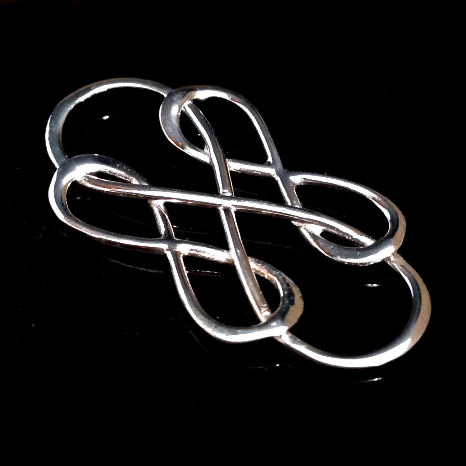 Triple Infinity Link in Smooth and Shiny Sterling Silver