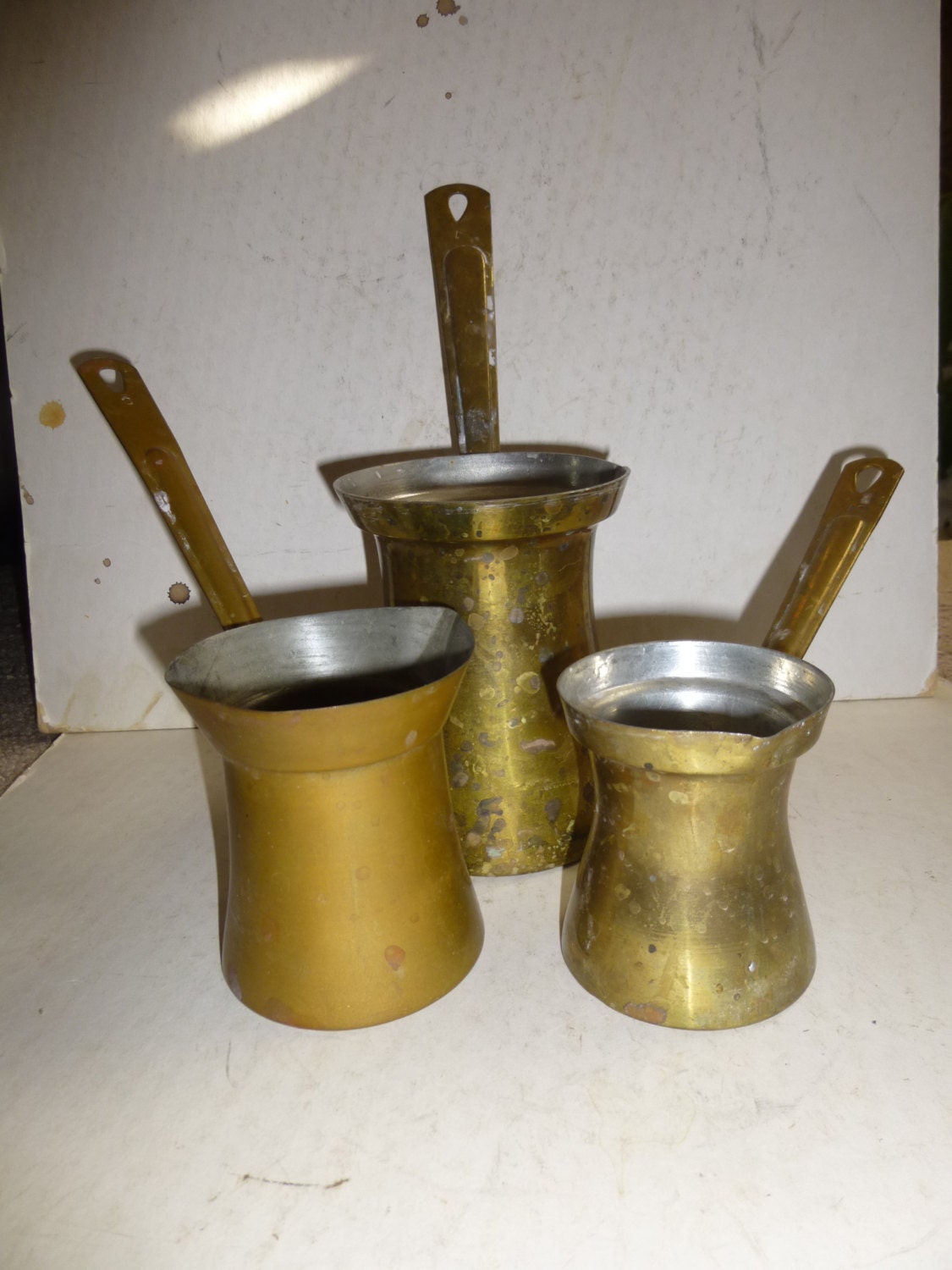 Trio of vintage tin lined copper coffee pots assorted sizes