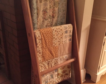 Items similar to Swing Arm Wall Mounted Quilt Rack on Etsy
