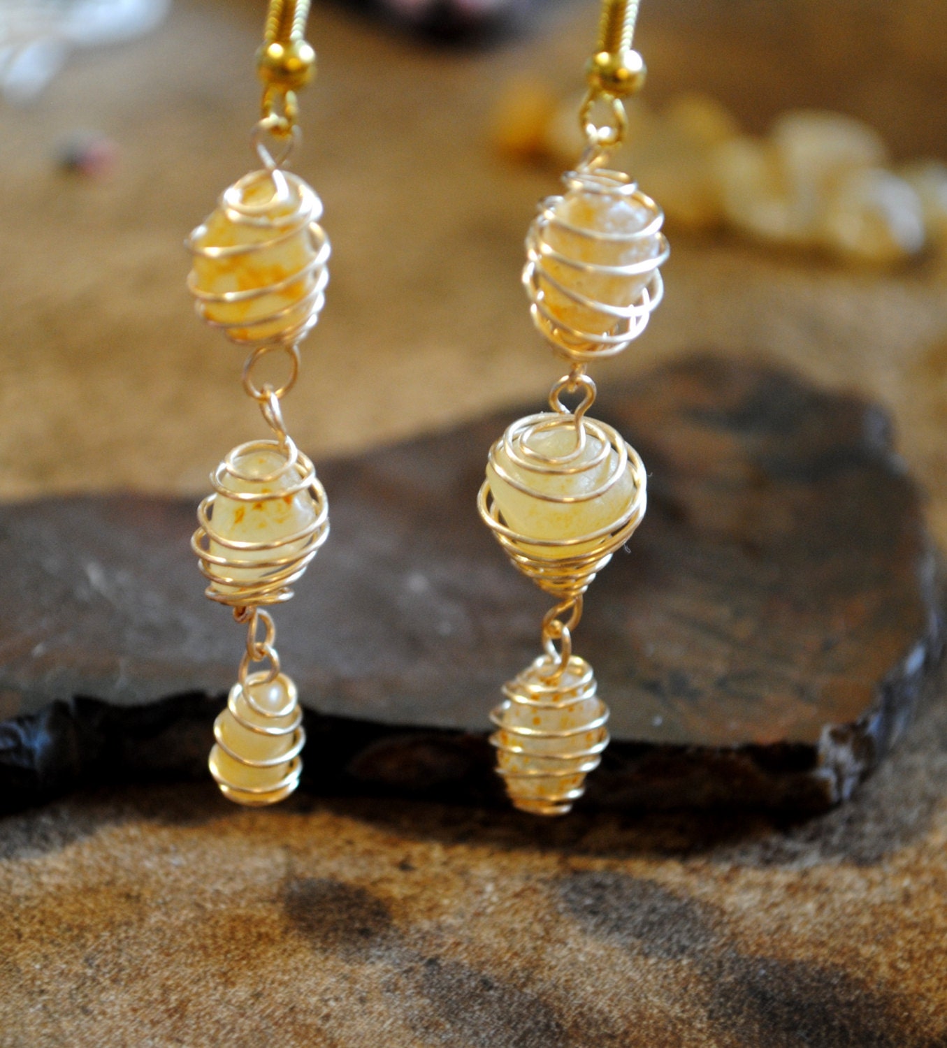 Raw agate dangle earrings wire wrapped in gold by TheOrigamiDonkey