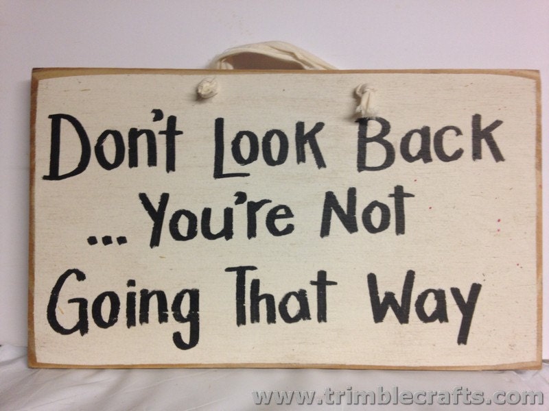 Don't look back You're not going that way sign