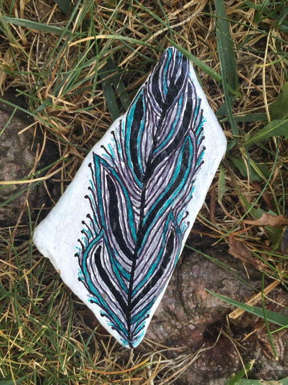 Items similar to Hand painted stone rock blue and black soft feather ...