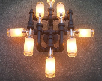 Wall Light. Lamp. Beer bottle Plumbing pipe & fittings. Wall