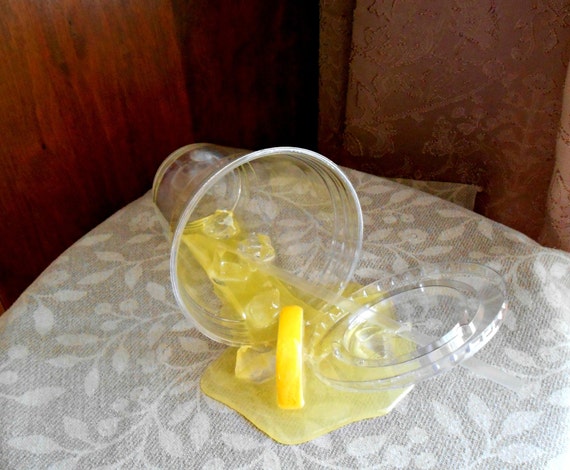 Fake Spilled Lemonade in a Plastic Cup With Lemon Slice
