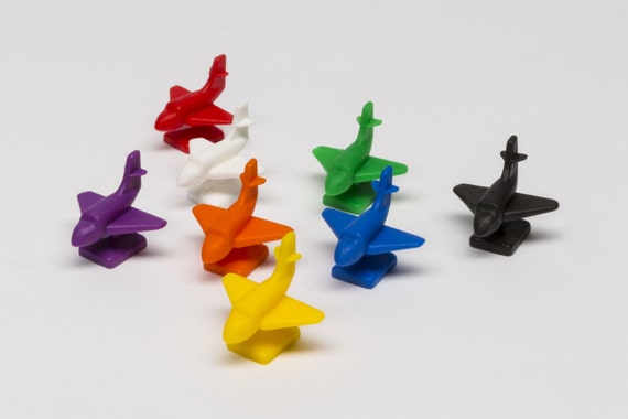 Plastic airplane board game piece.