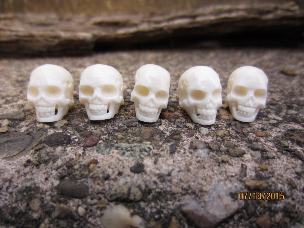 Amazing detail Hand Carved Bone 5 piece small Skull Bead