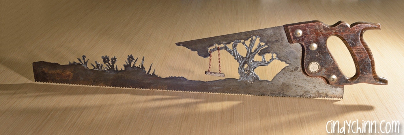 Metal Art Rustic custom hand saw featuring a 'Swing on a