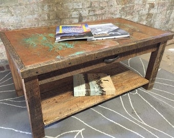 Reclaimed wood coffee table with multi-colored stain and lower