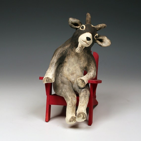 Ceramic Billy Goat sitting on red Adirondack Chair original
