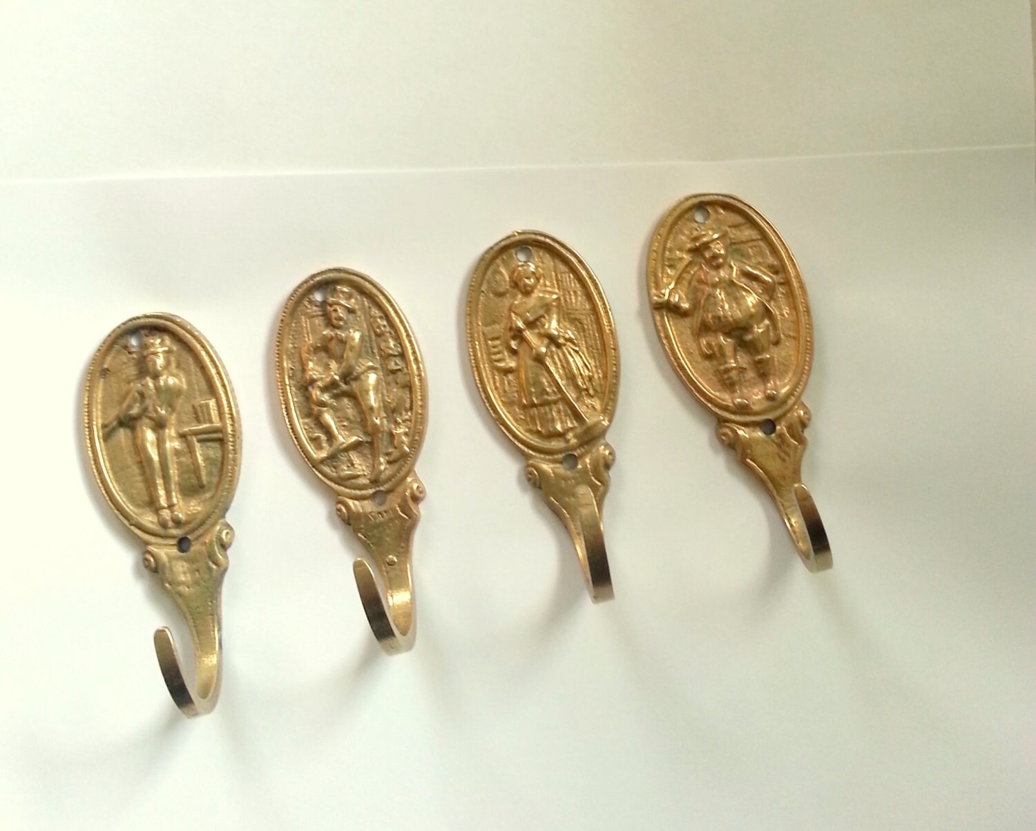4 Antique brass coat hooks with different characters – Haute Juice