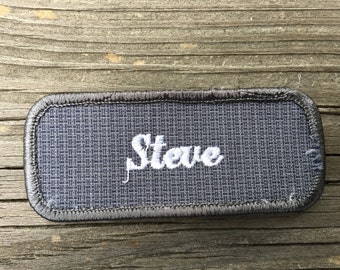 Zack. A yellow work shirt patch that says Zack in