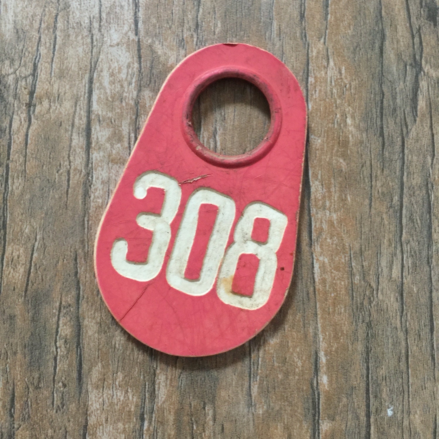 Vintage plastic cow tag red number 308 antique plastic