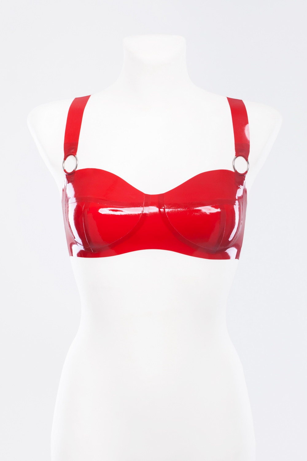 Latex bra decorated with metallic rings