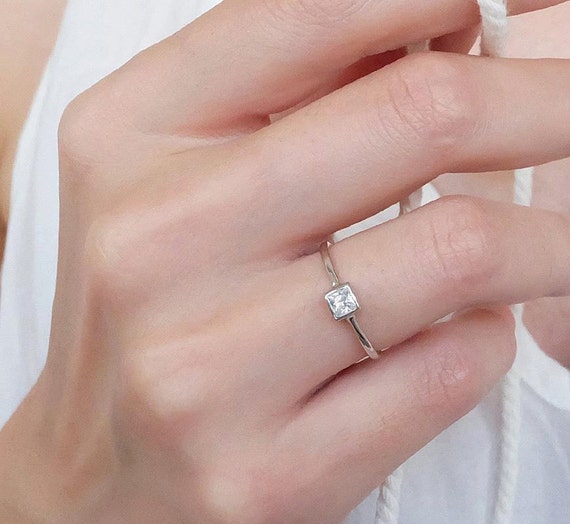 classic solitaire square ring solitaire ring by Lessaremore