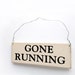 Wood sign saying: Gone Running