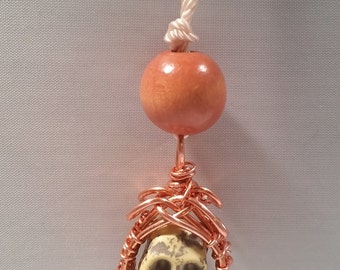Items similar to Orange and Copper Skull necklace on Etsy