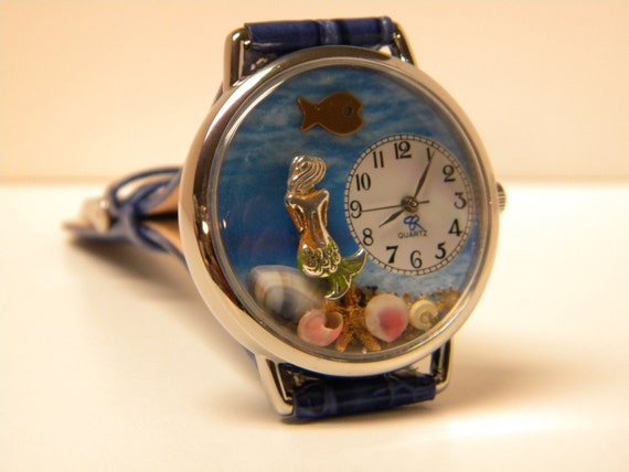 Mermaid Watch with sand shells starfish and a fish