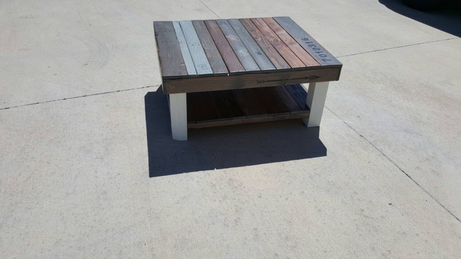 Reclaimed wood coffee table with multi-colored stain and lower