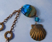 Unique lampwork shell beads related items | Etsy