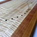 Large cutting board with dotted curved inlay