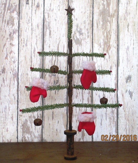 Primitive Faux German Single Feather Tree with rusty star and