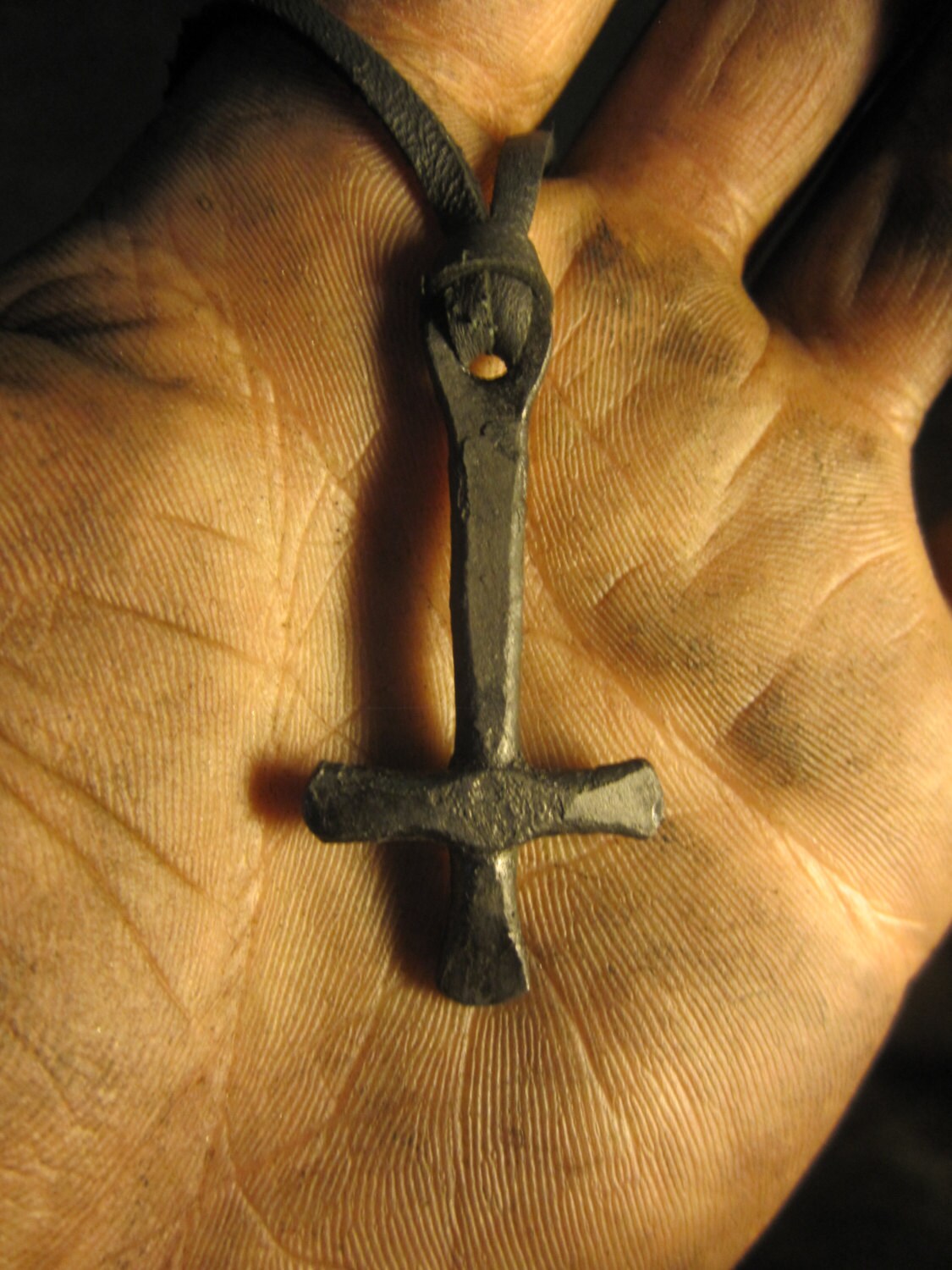 A hand forged inverted Cross pendant . Comes supplied with a
