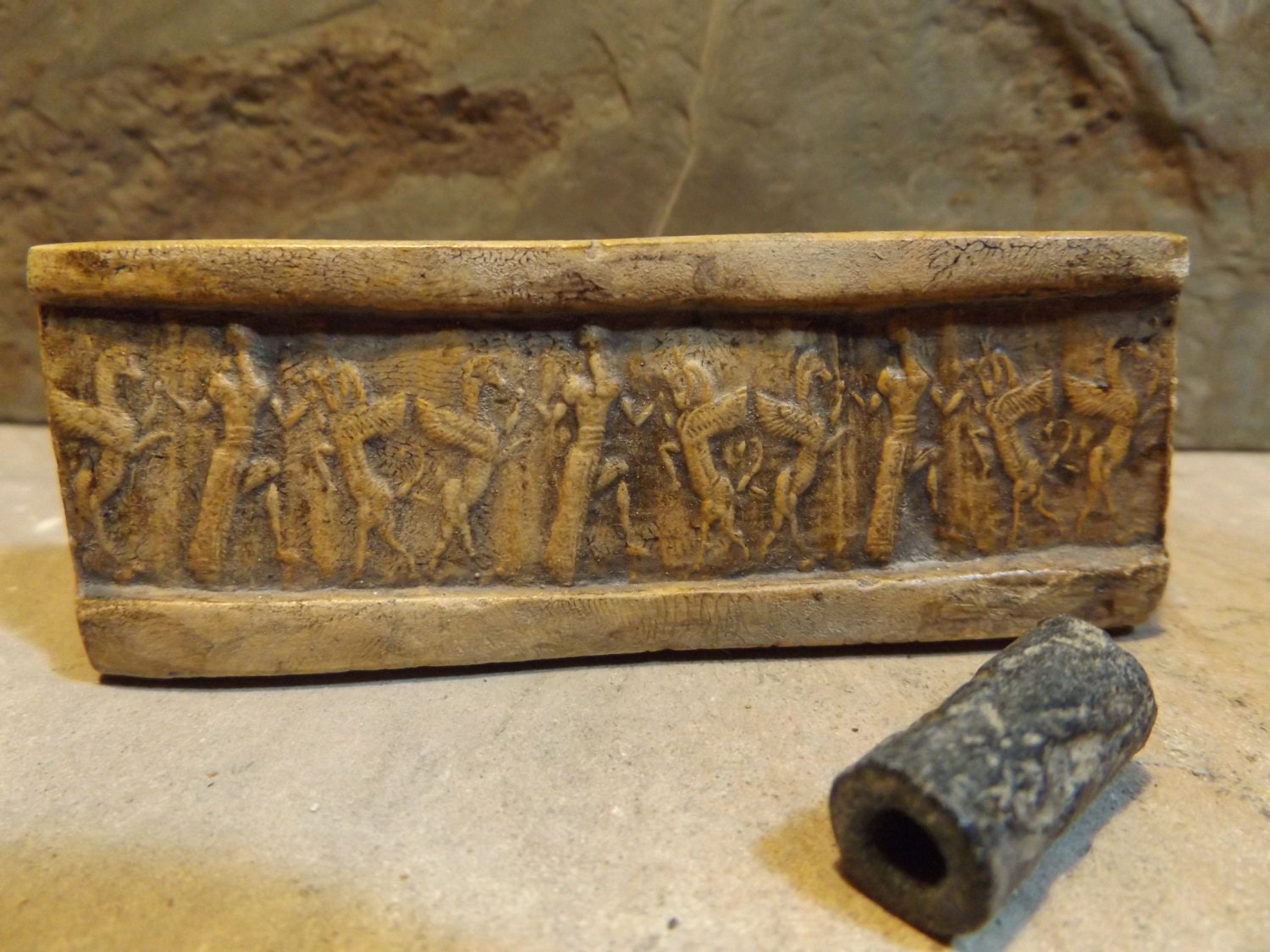 Mesopotamia Assyrian cylinder seal impression - Wrestling winged bull ...