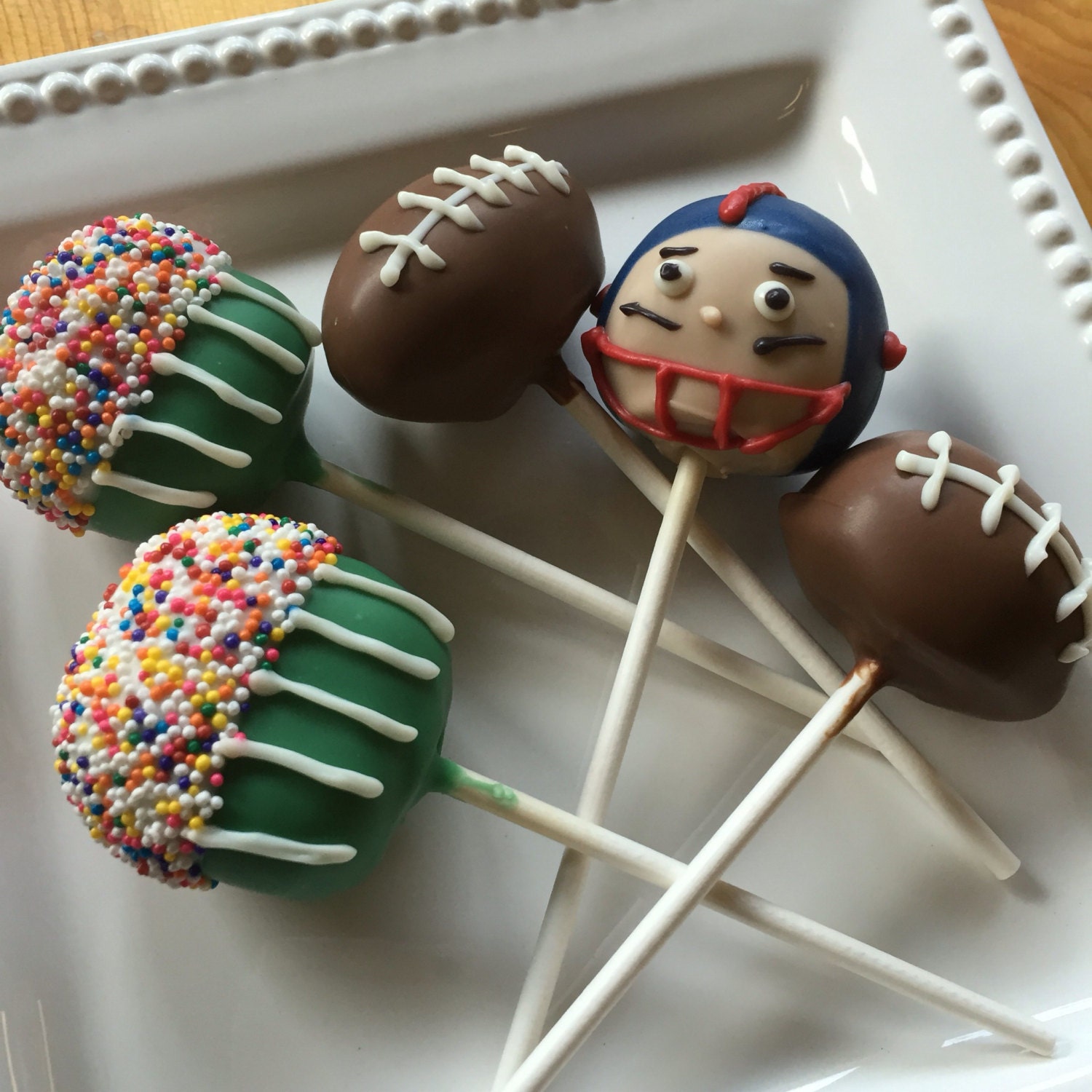 Football themed cake pops