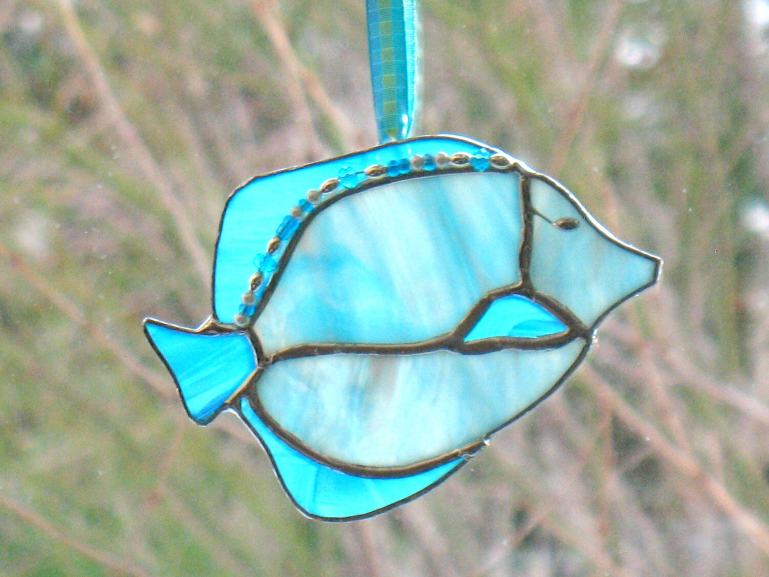 Turquoise blue stained glass fish tropical sealife