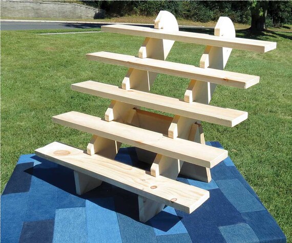 Collapsible riser portable display stand store by PortableDisplays