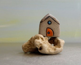 Ceramic miniature houses on natural stone ceramic sculpture
