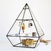 Pyramid with a glass shelf and a bar for earrings Pyramid