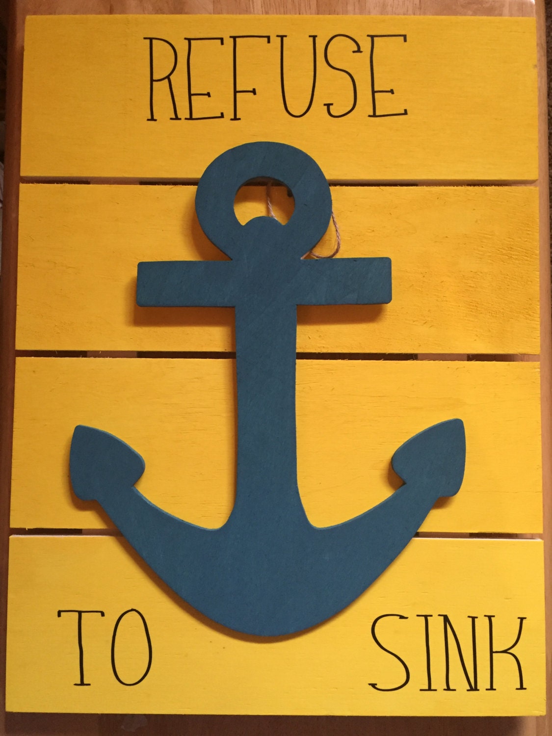 Refuse to sink wooden sign