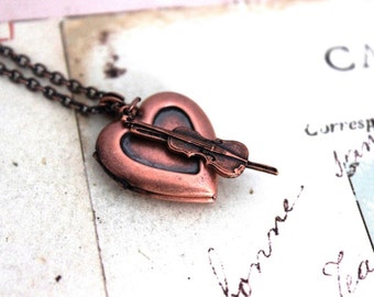 G Clef music notes. heart locket necklace. silver ox by babyjewlz