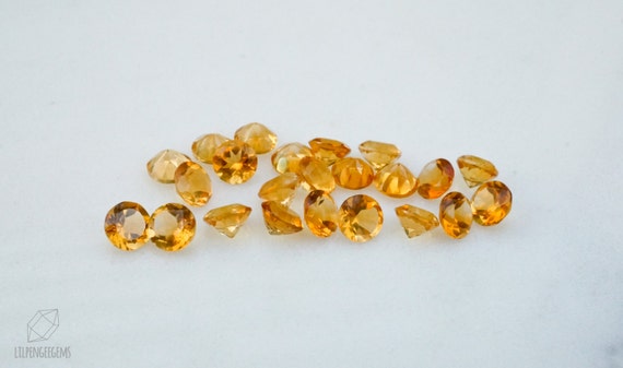5mm golden citrine faceted gemstone. yellow citrine gem. round