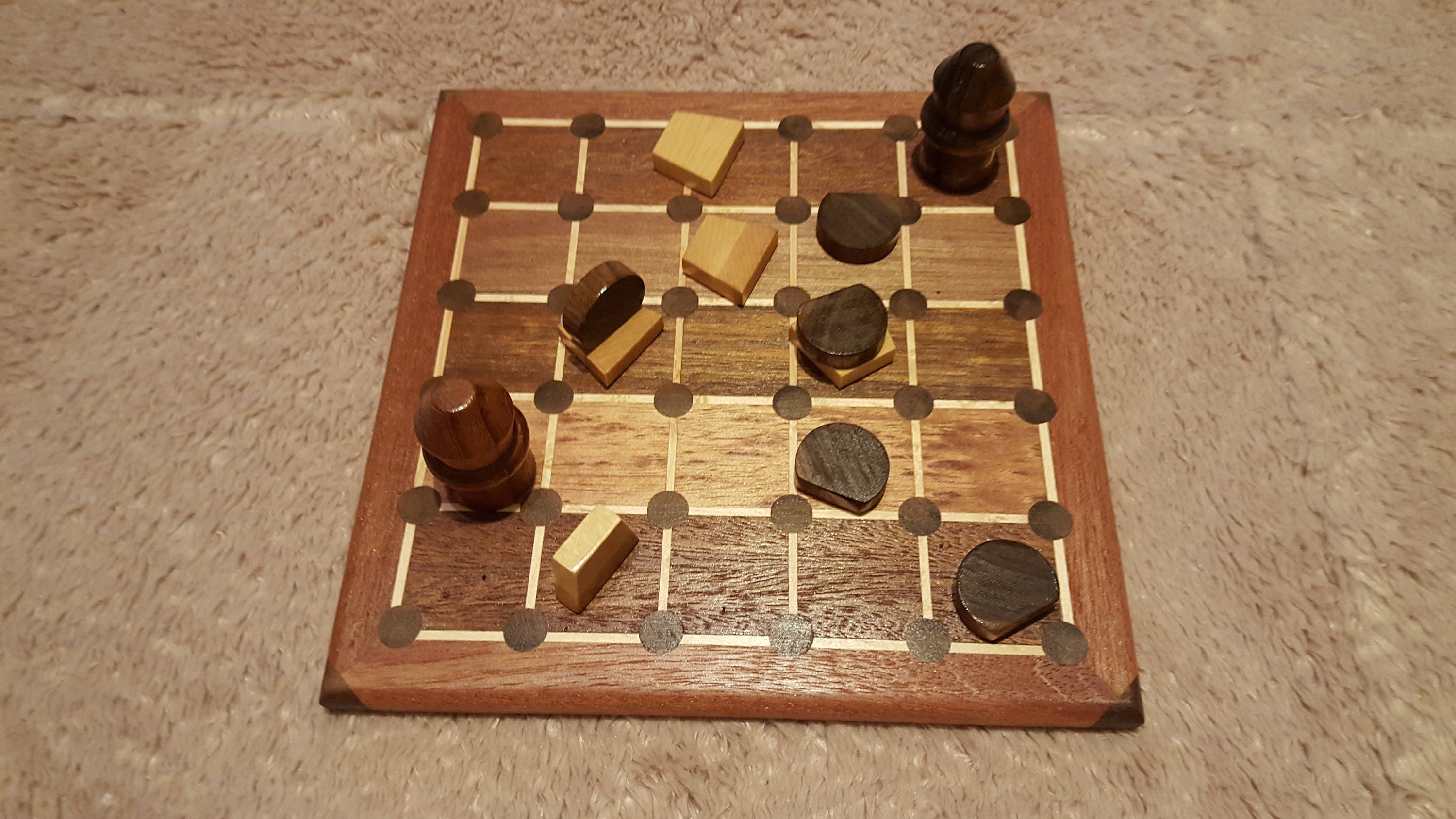 Tak board with game pieces