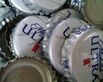 100 Michelob Ultra bottle caps. Dented.