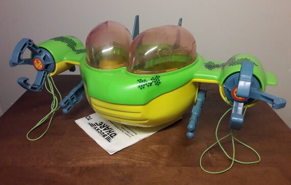 My memory of a strange 90s toy (a green spaceship) maybe something from ...