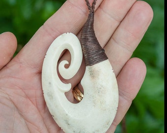 Hand Made Bound Maori Matau Fish Hook bone carving by BoneArtPlace