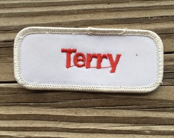 Zack. A yellow work shirt patch that says Zack in