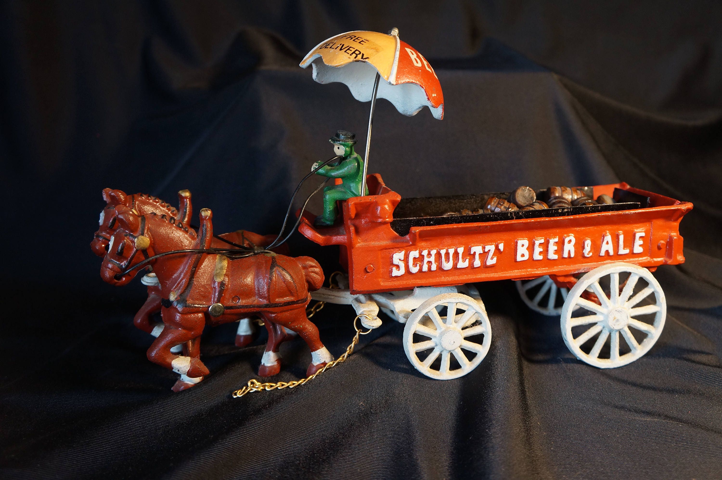 Cast iron Schultz' Beer and Ale Wagon with wood beer barrels